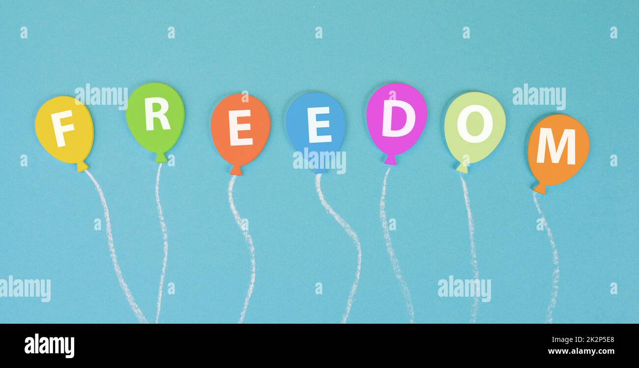The word freedom is standing on ballons, new normal, covid-19 ...