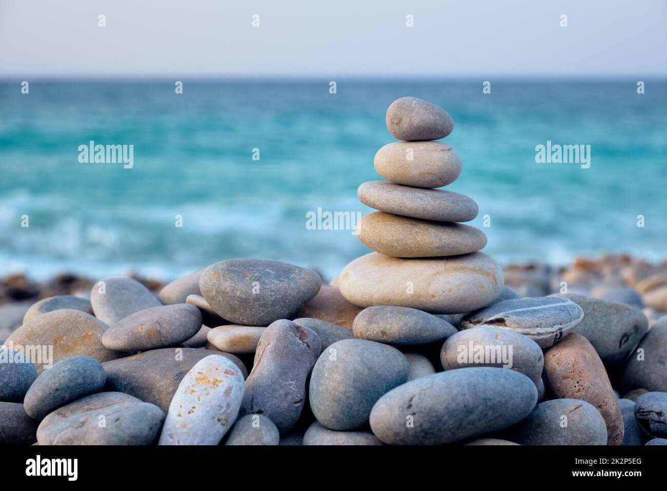 Zen balanced stones stack on beach Stock Photo - Alamy