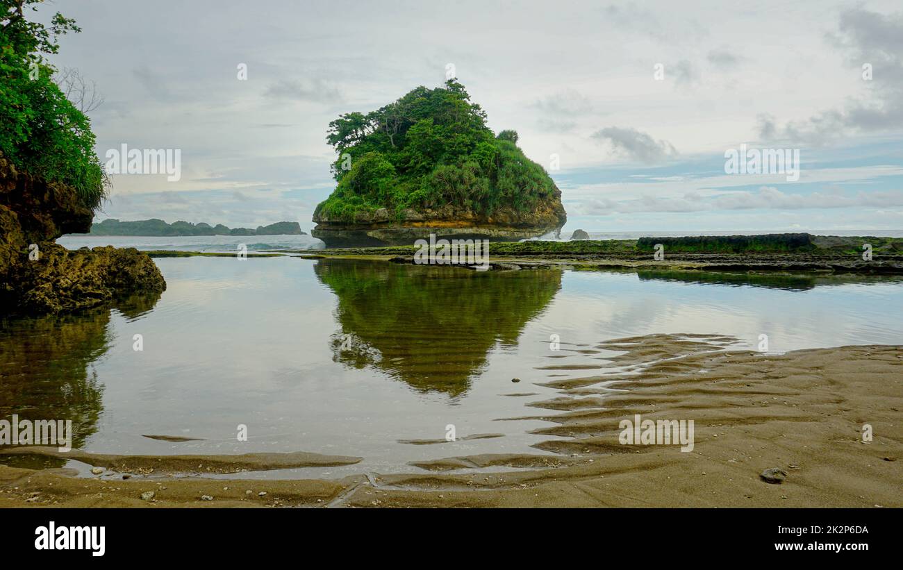 a photo of a small island by the beach Stock Photo - Alamy