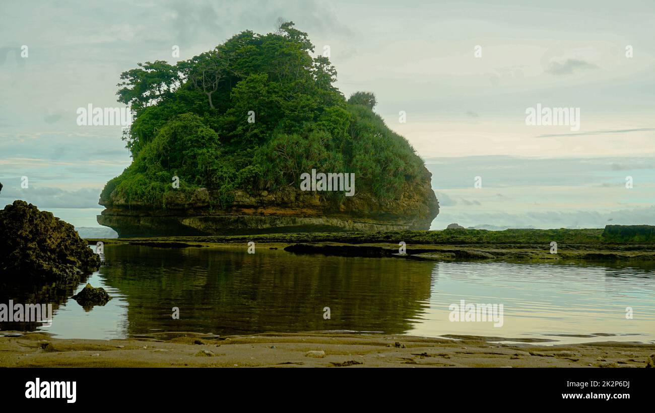 a photo of a small island by the beach Stock Photo - Alamy