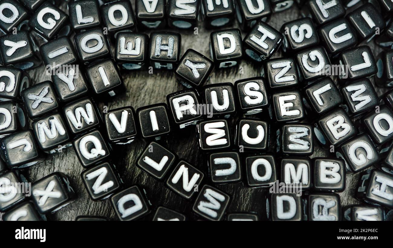 cube alphabet scattered to form the word virus Stock Photo - Alamy