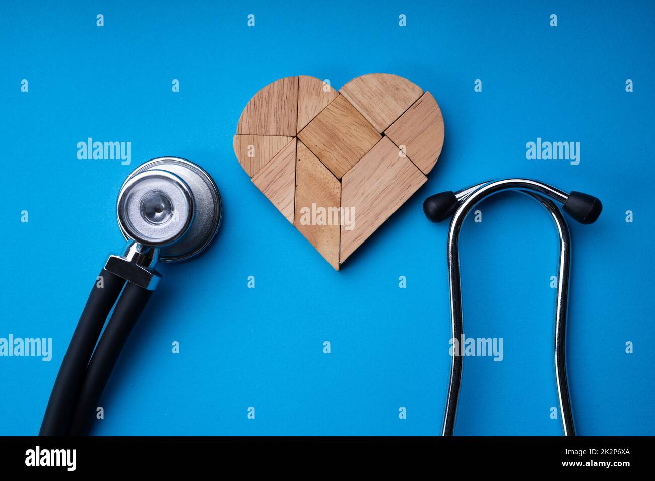 Examining Red Heart With Stethoscope Stock Photo - Alamy