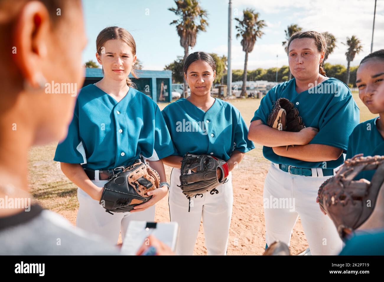 Coach of girl team in baseball, give strategy to players before game or ...