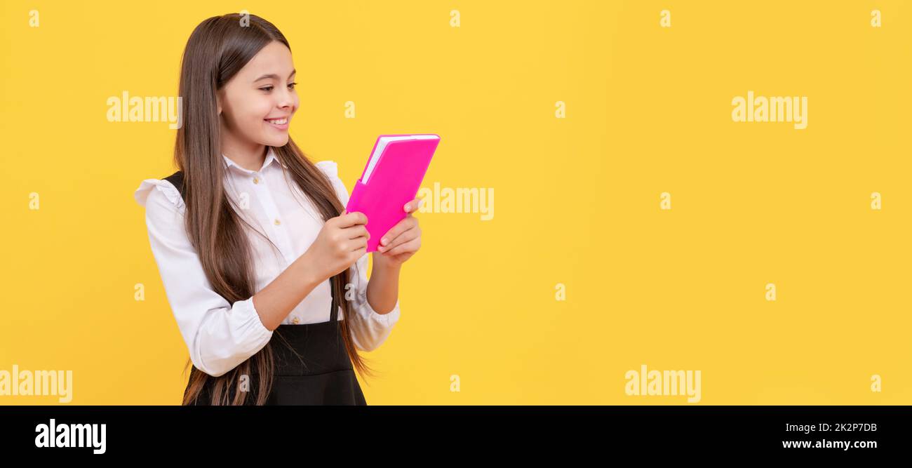 happy teen girl in school uniform reading book, literature. Portrait of ...