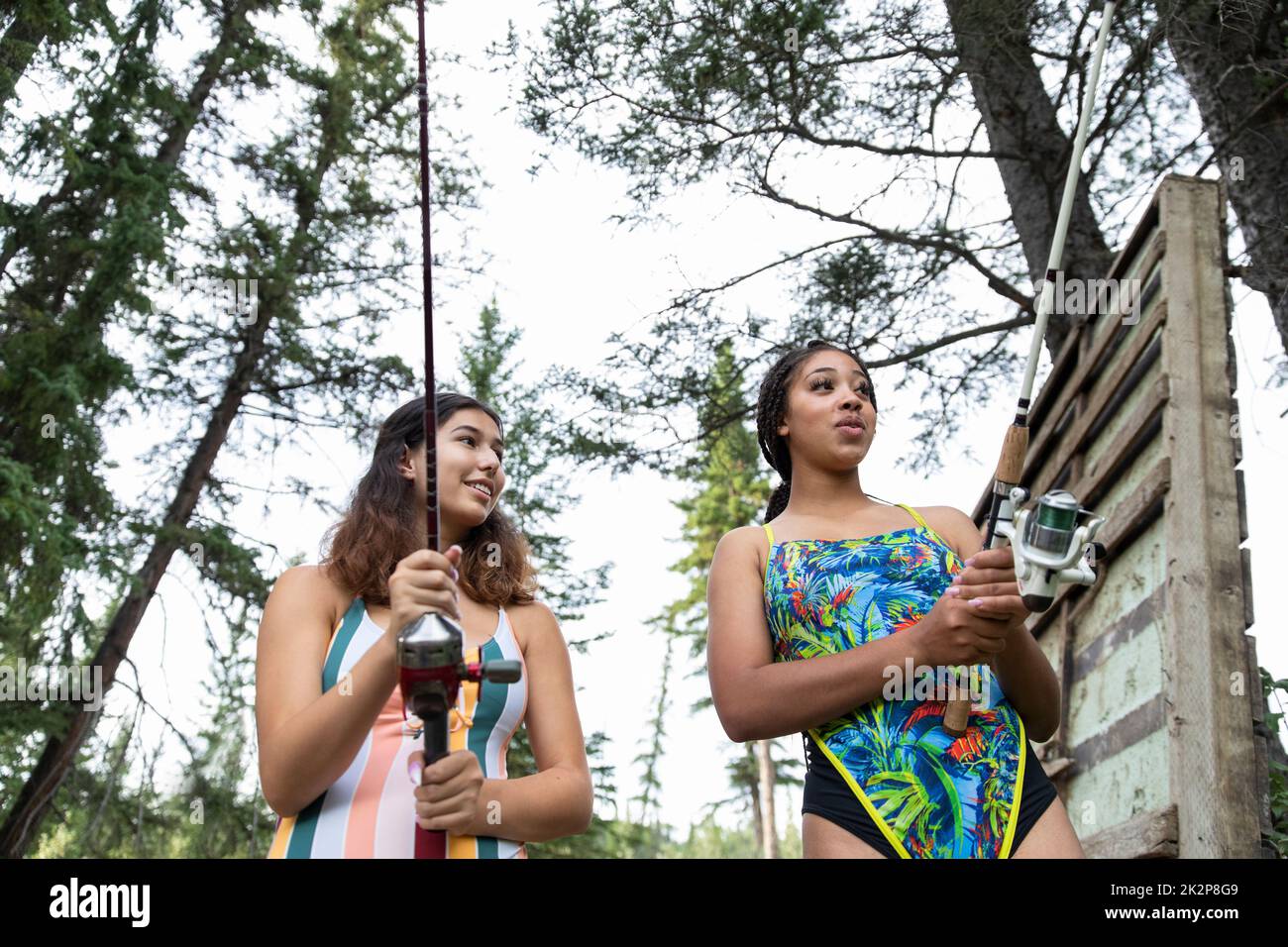 Two girls fishing hi-res stock photography and images - Alamy