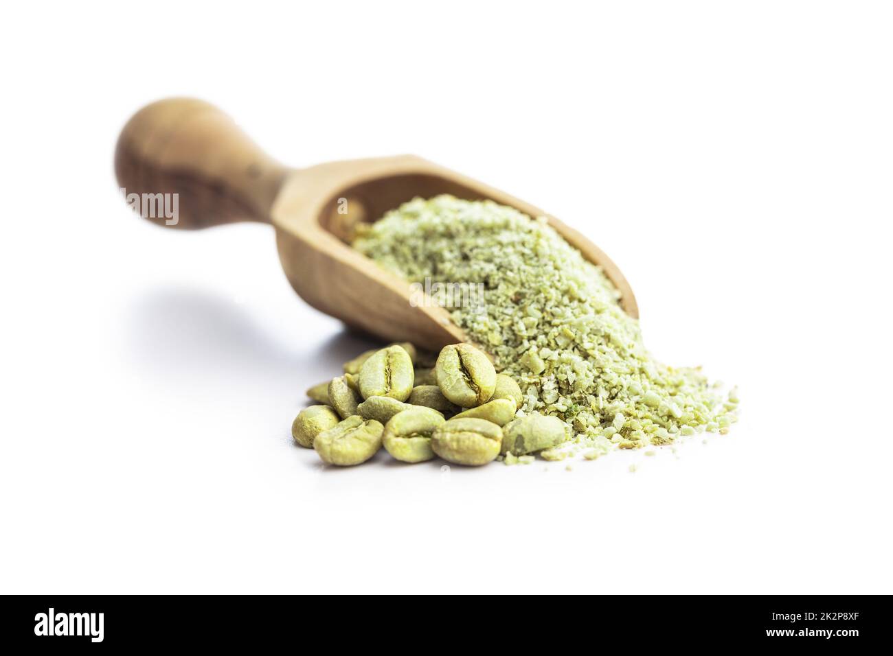 Ground green coffee and coffee beans in scoop. Unroasted coffee ...