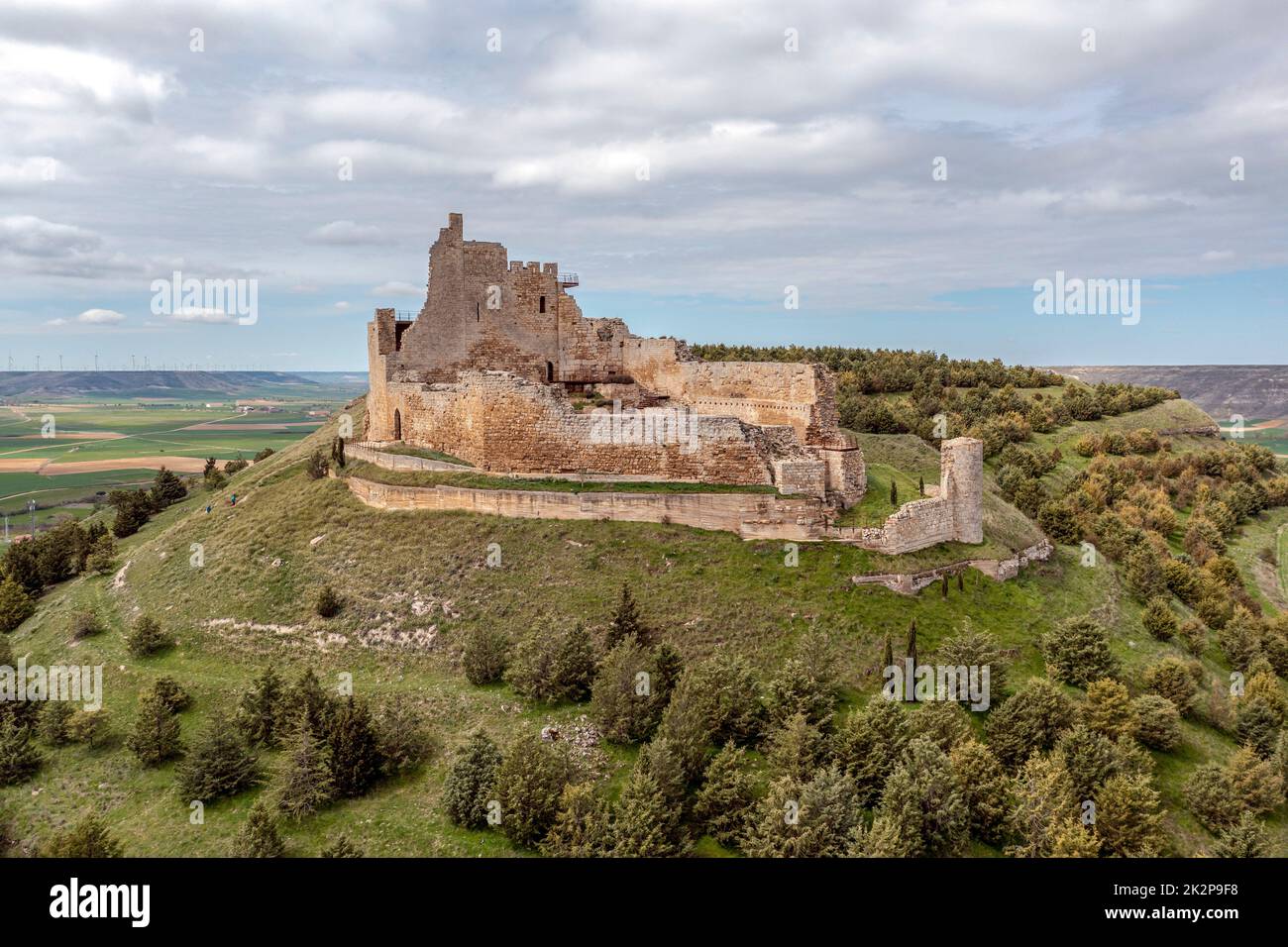 A prominent castle in ruins up on the hill - Castrojeriz, Castile and ...