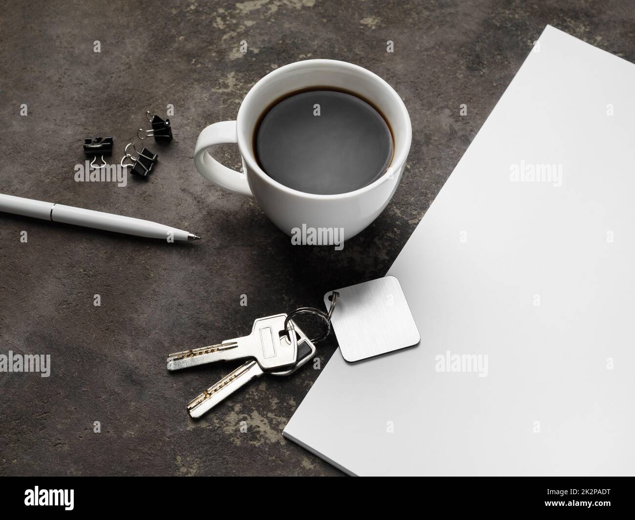 Keys, coffee cup, stationery Stock Photo - Alamy