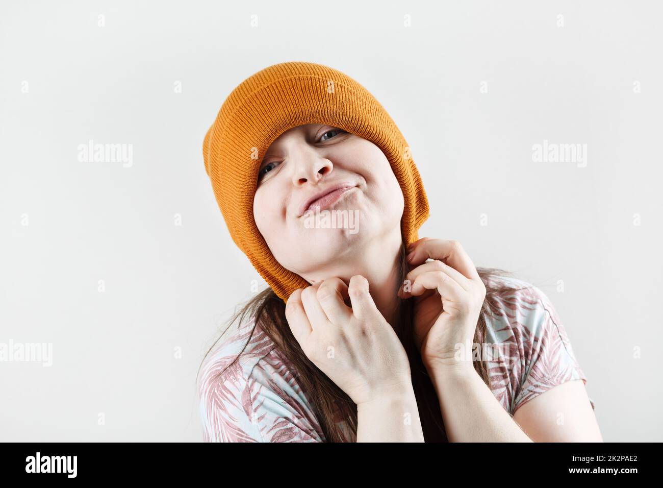 Woman pulled knitted hat Stock Photo - Alamy