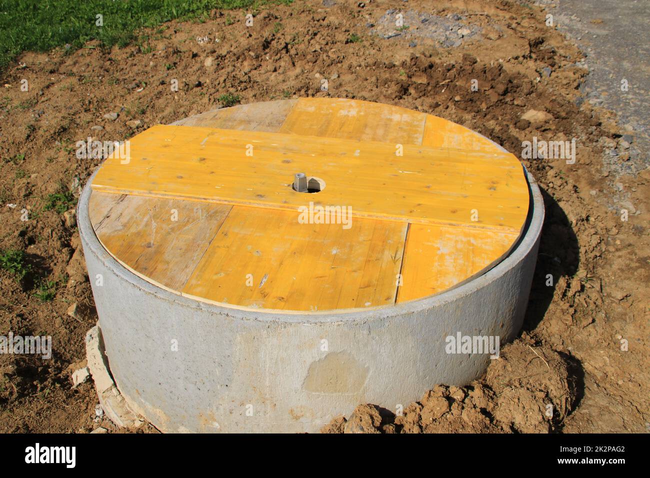 The manhole was provisionally covered with a wooden cover Stock Photo ...