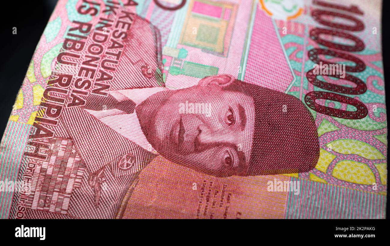 Indonesian money is one hundred thousand rupiah Stock Photo - Alamy