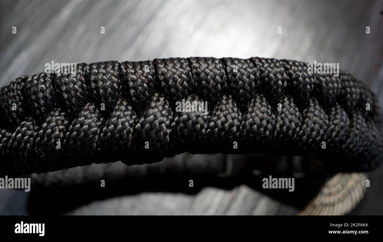 black bracelet paracord knots Stock Photo - Alamy