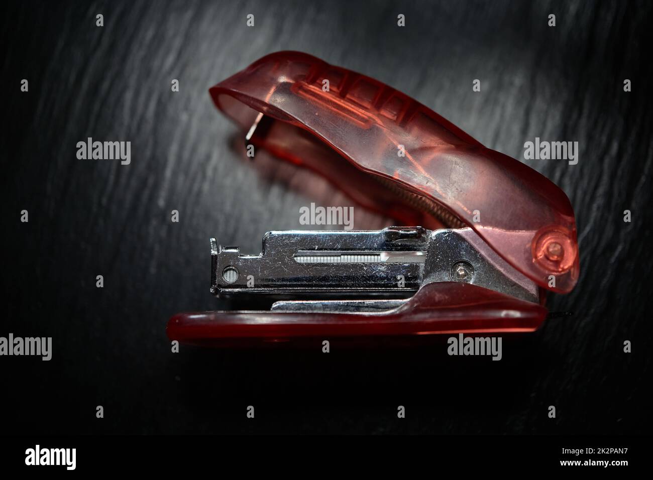 mini red paper staples Stock Photo - Alamy