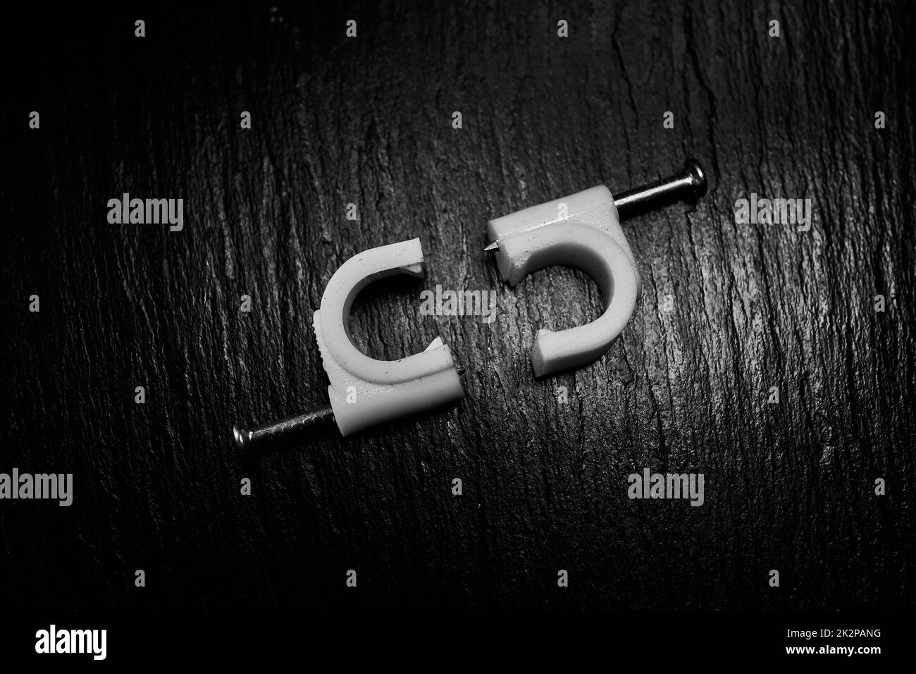 nail clamp for wiring Stock Photo - Alamy