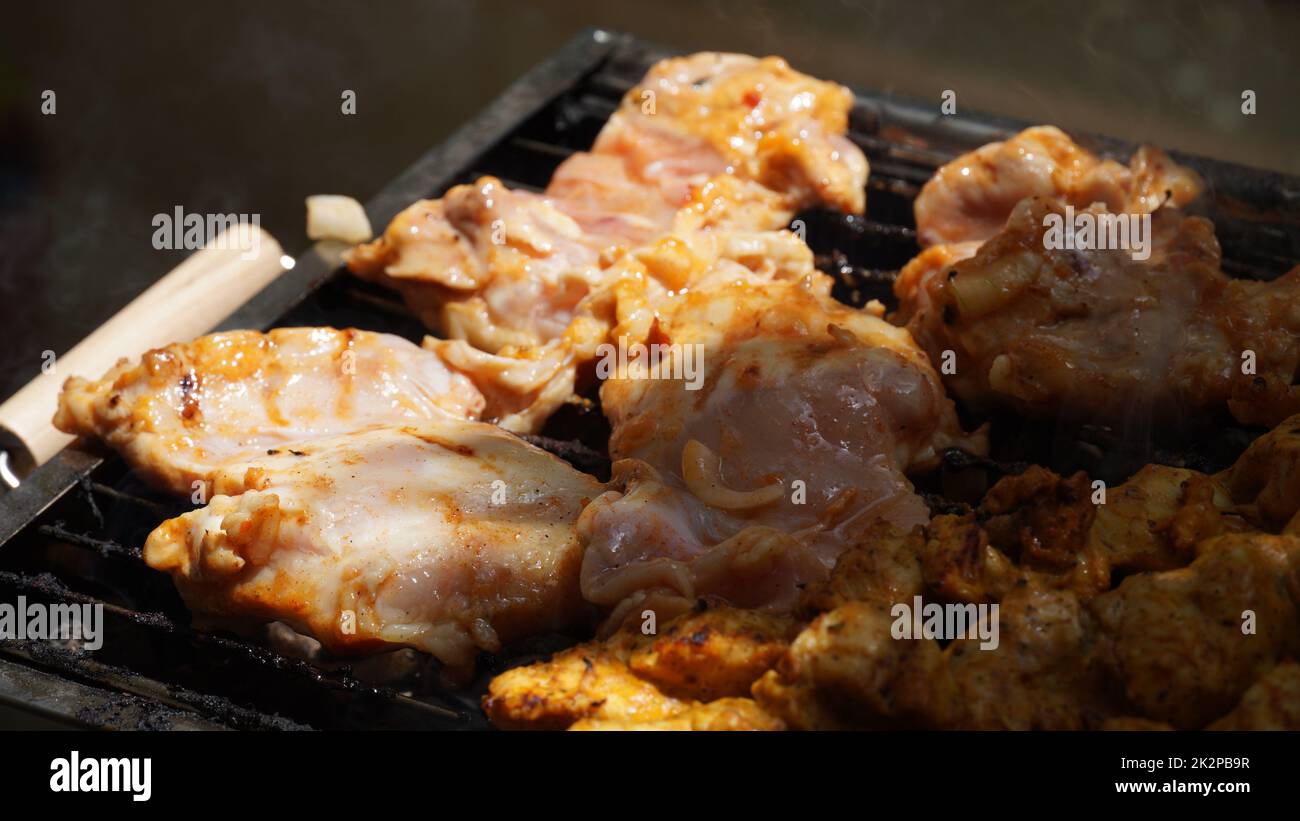 Fresh chicken steak grill meat on fire. Making barbecue on the grill ...