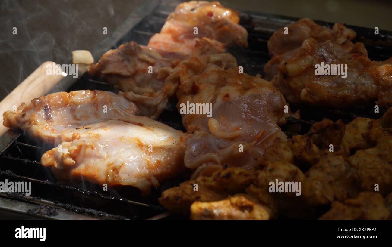 Fresh chicken steak grill meat on fire. Making barbecue on the grill ...