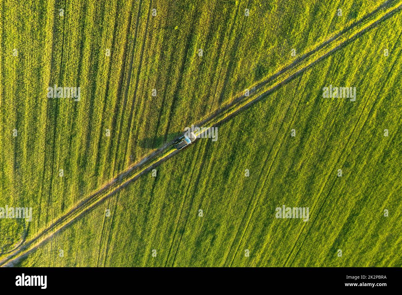 Aerial view of car SUV parked near countryside road in field rural ...