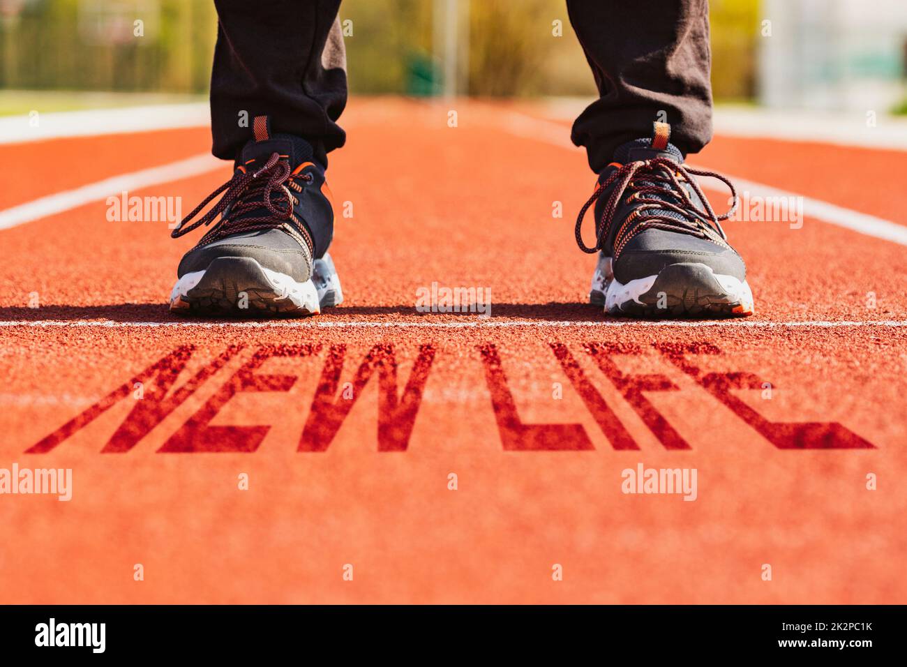 Man standing next to line and words NEW LIFE Stock Photo - Alamy