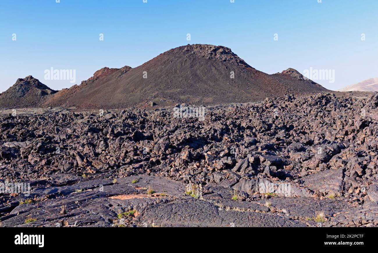Lava Flows and Cinder Cones in a Desolate Landscape Stock Photo - Alamy
