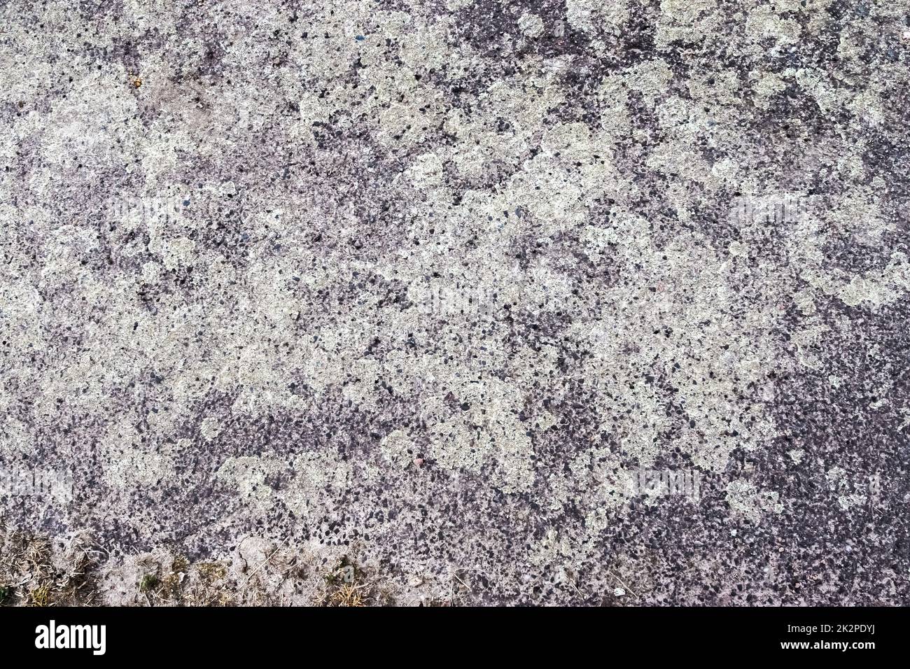 Asphalt surfaces of damaged streets and roads with cracks in a close up ...