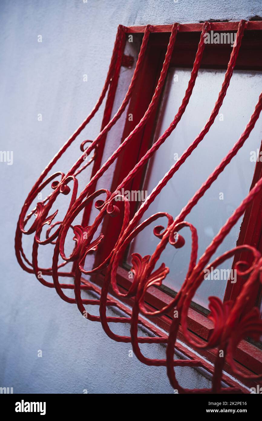 Window with red decorated bars Stock Photo - Alamy