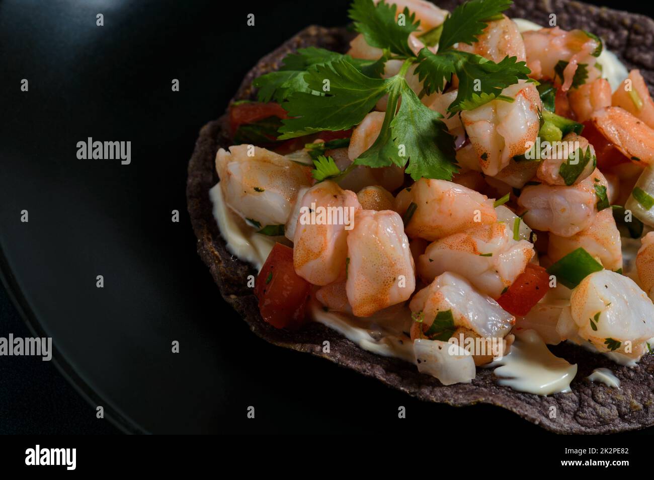 Red shrimp ceviche and blue corn tostadas Stock Photo - Alamy