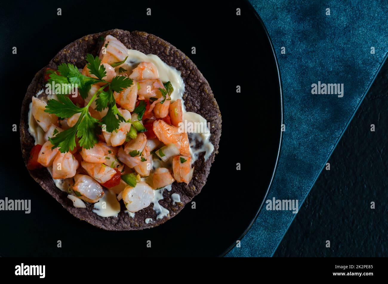 Red shrimp ceviche and blue corn tostadas Stock Photo - Alamy