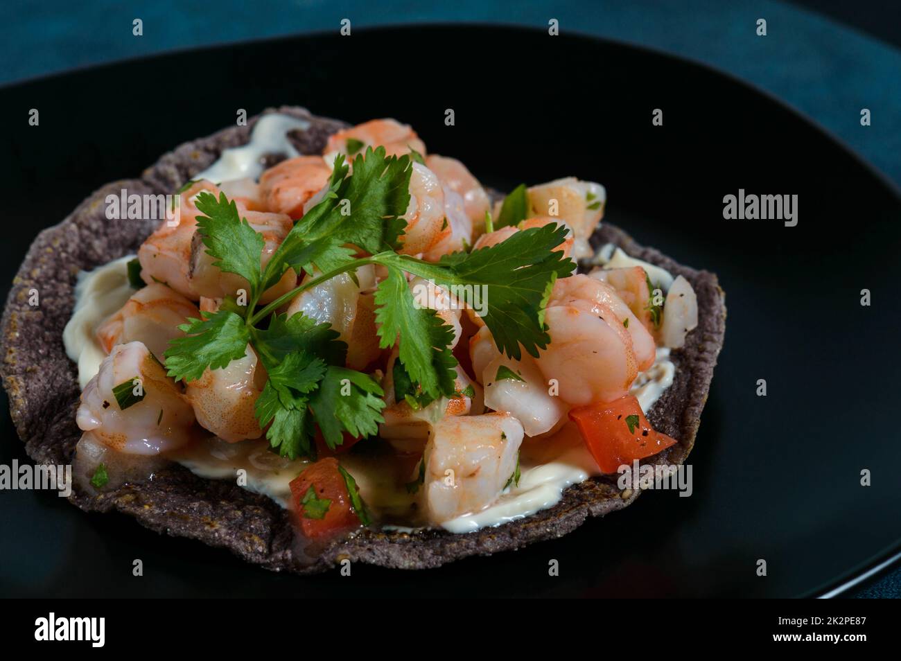Red shrimp ceviche and blue corn tostadas Stock Photo - Alamy
