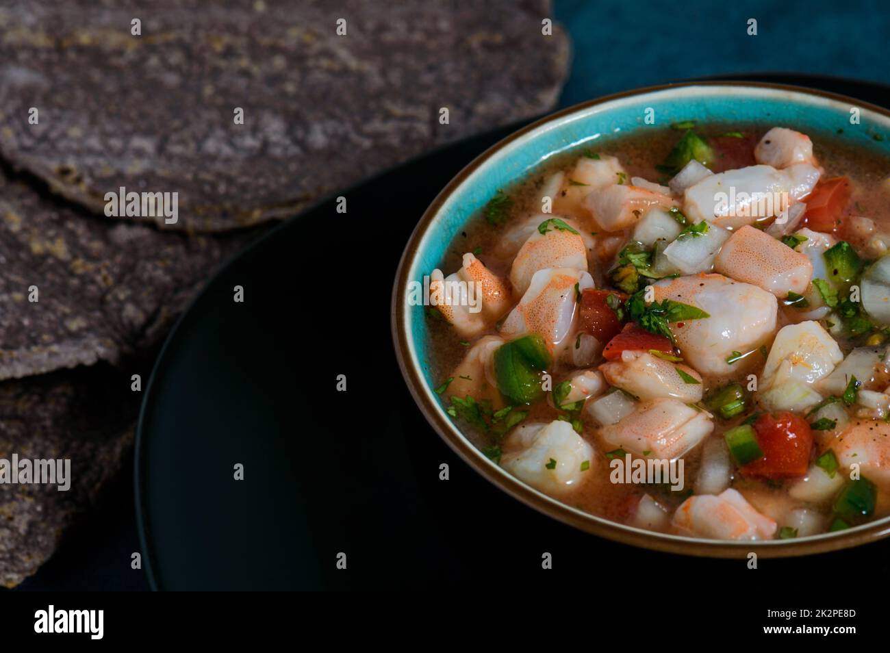 Red shrimp ceviche and blue corn tostadas Stock Photo - Alamy