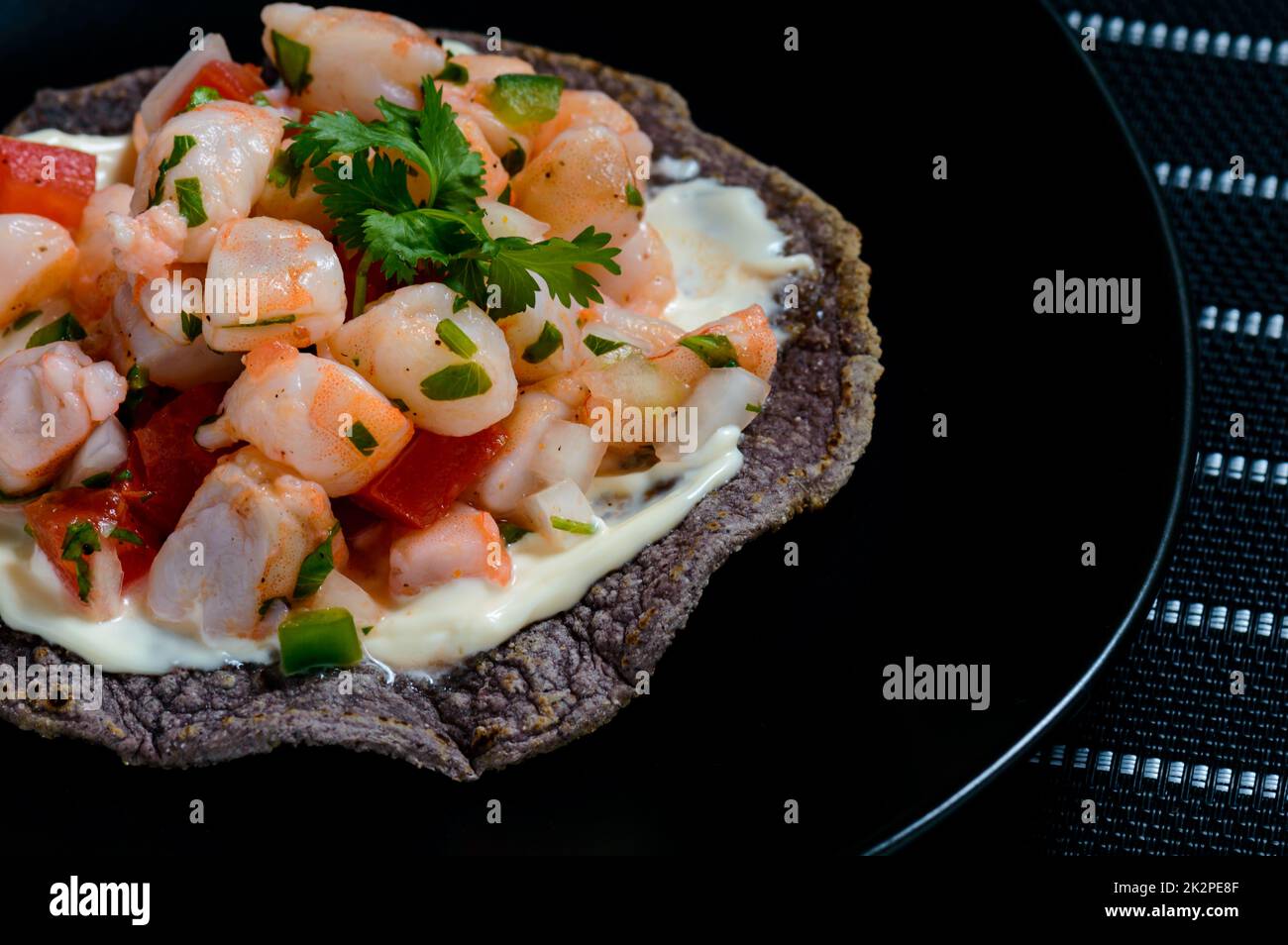 Red shrimp ceviche and blue corn tostadas Stock Photo - Alamy