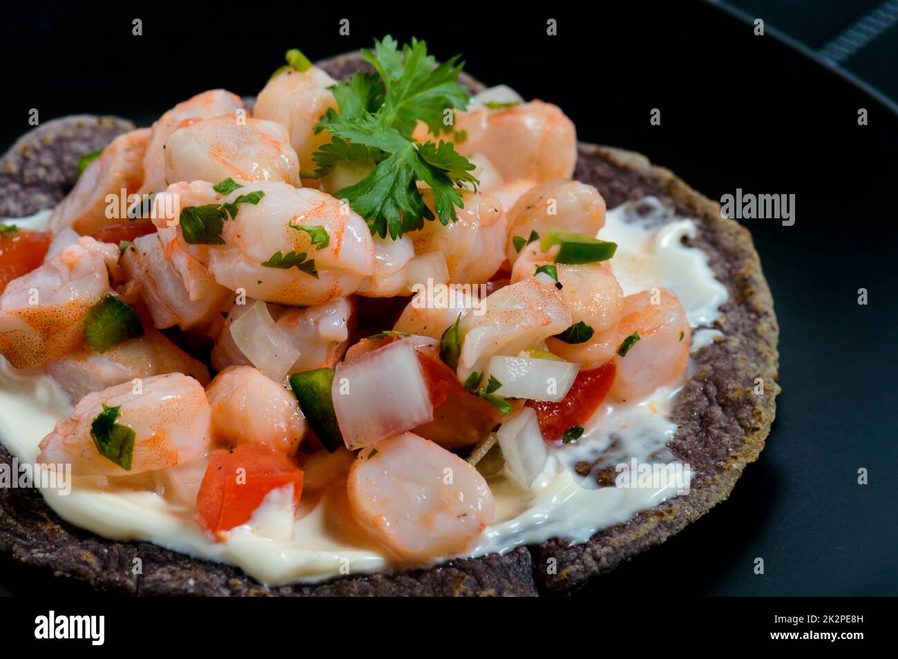 Red shrimp ceviche and blue corn tostadas Stock Photo - Alamy