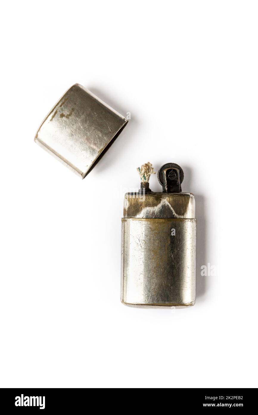 Old vintage lighter isolated on a white background Stock Photo - Alamy