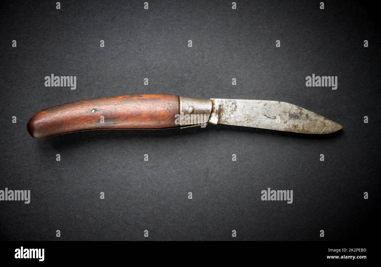 Traditional wooden pocket knife on black background Stock Photo - Alamy
