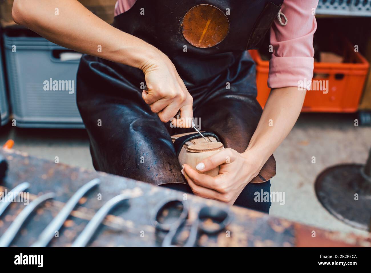 Shoemaker working on the frame of a shoe Stock Photo - Alamy