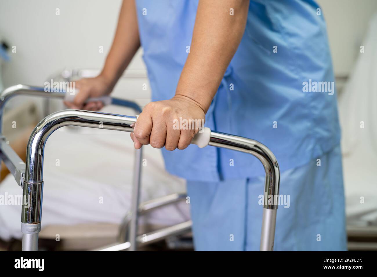 Asian lady woman patient walk with walker at nursing hospital ward ...