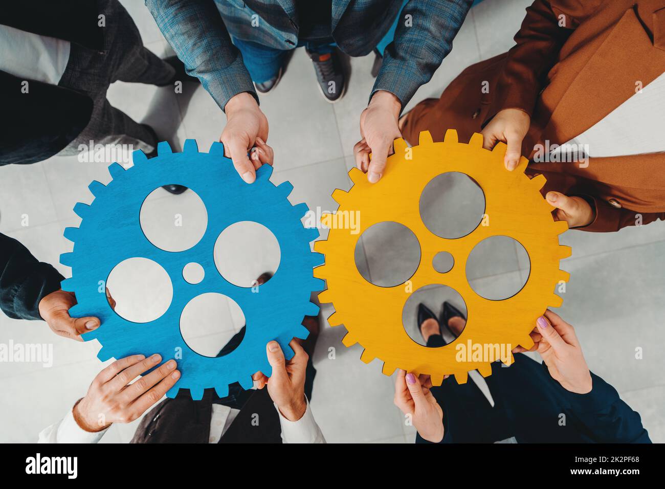Business team connect pieces of gears like a teamwork and partners ...