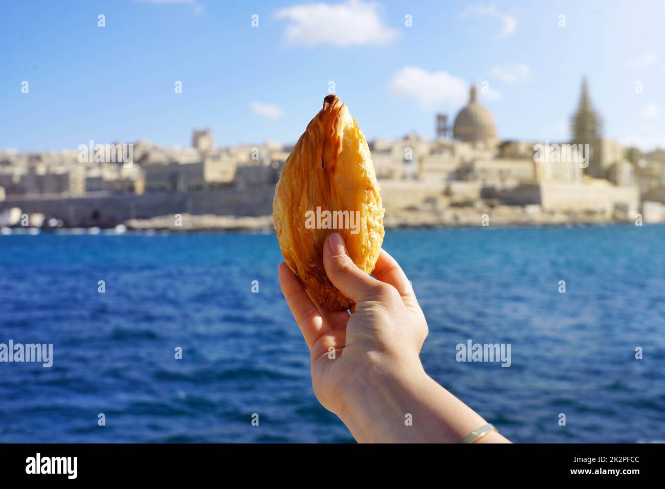 Traditional savoury pastry Pastizzi from Malta with Valletta old town ...