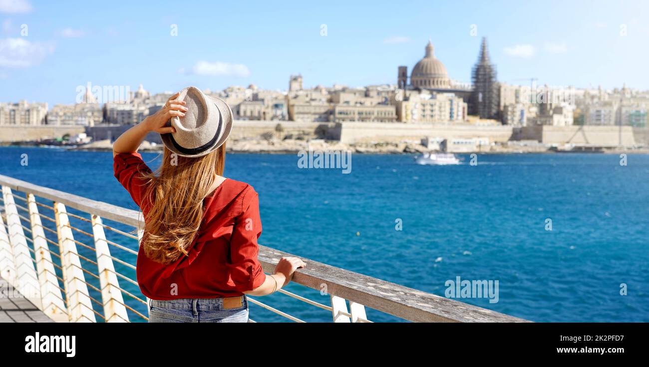 Traveling in Europe. Panoramic view of female tourist holding hat ...