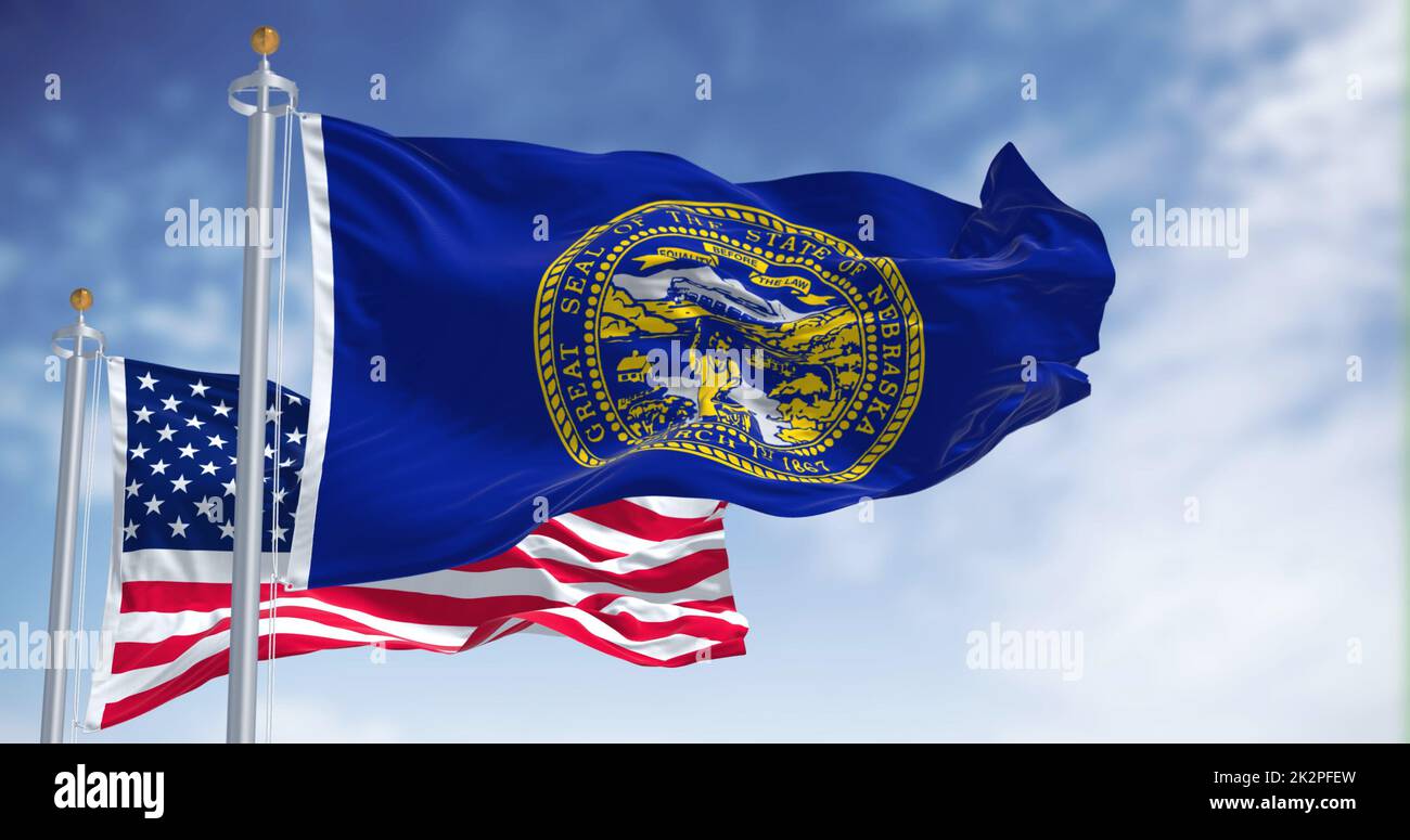 The Nebraska state flag waving along with the national flag of the ...