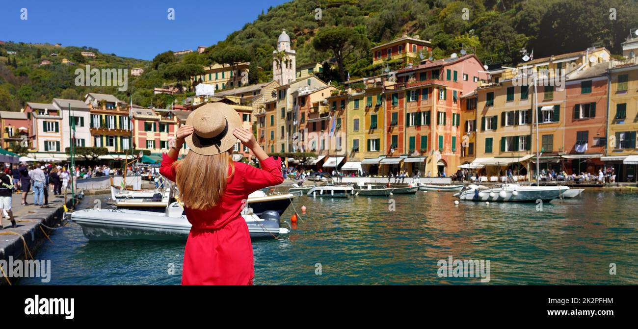 Holidays in Portofino, Italy. Back view of beautiful girl in red dress ...