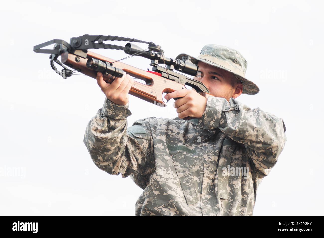 aiming and shooting with crossbow Stock Photo - Alamy