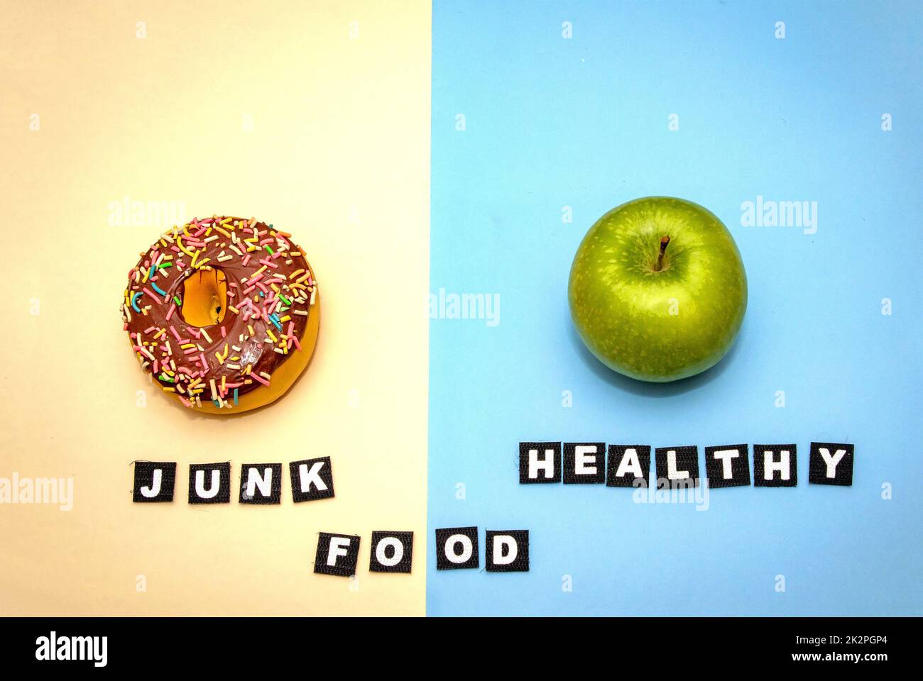 Junk and healthy food comparison Stock Photo - Alamy