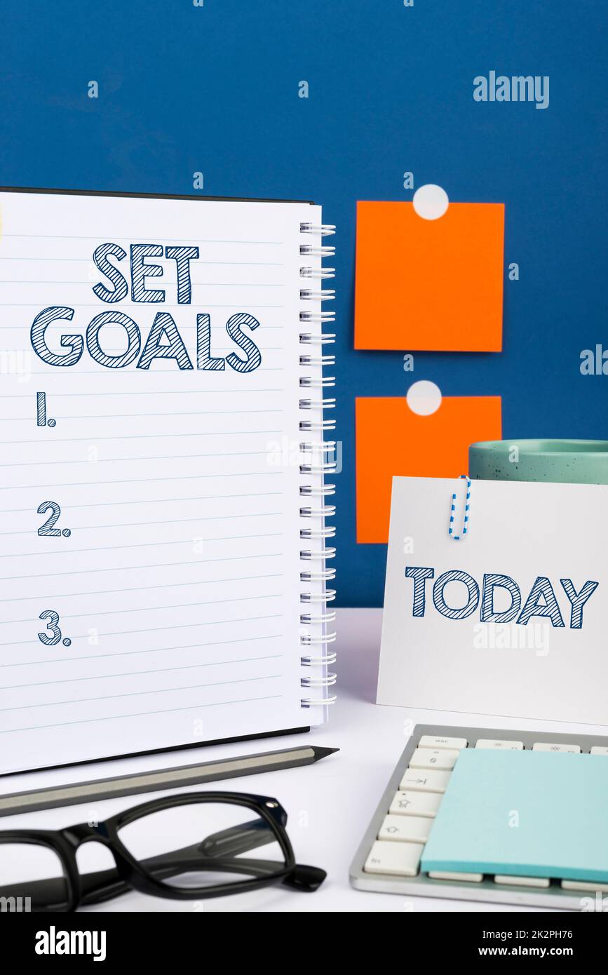 Hand writing sign Set Goals. Word Written on Defining or achieving ...