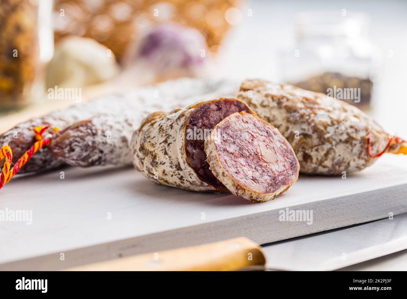 Traditional sausage with white mold. Dried sliced pork salami on ...