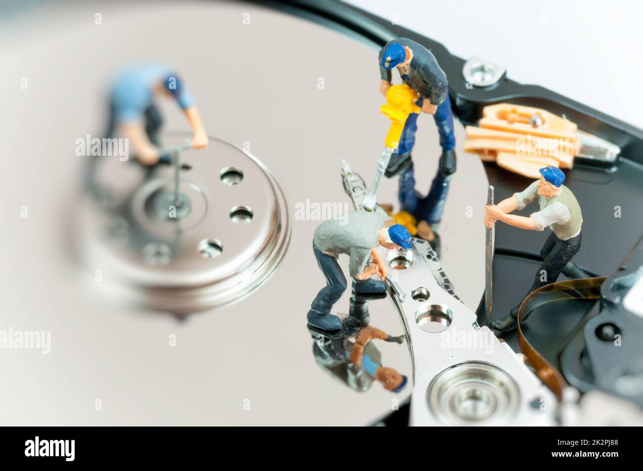 Workers repairing hard drive Stock Photo - Alamy