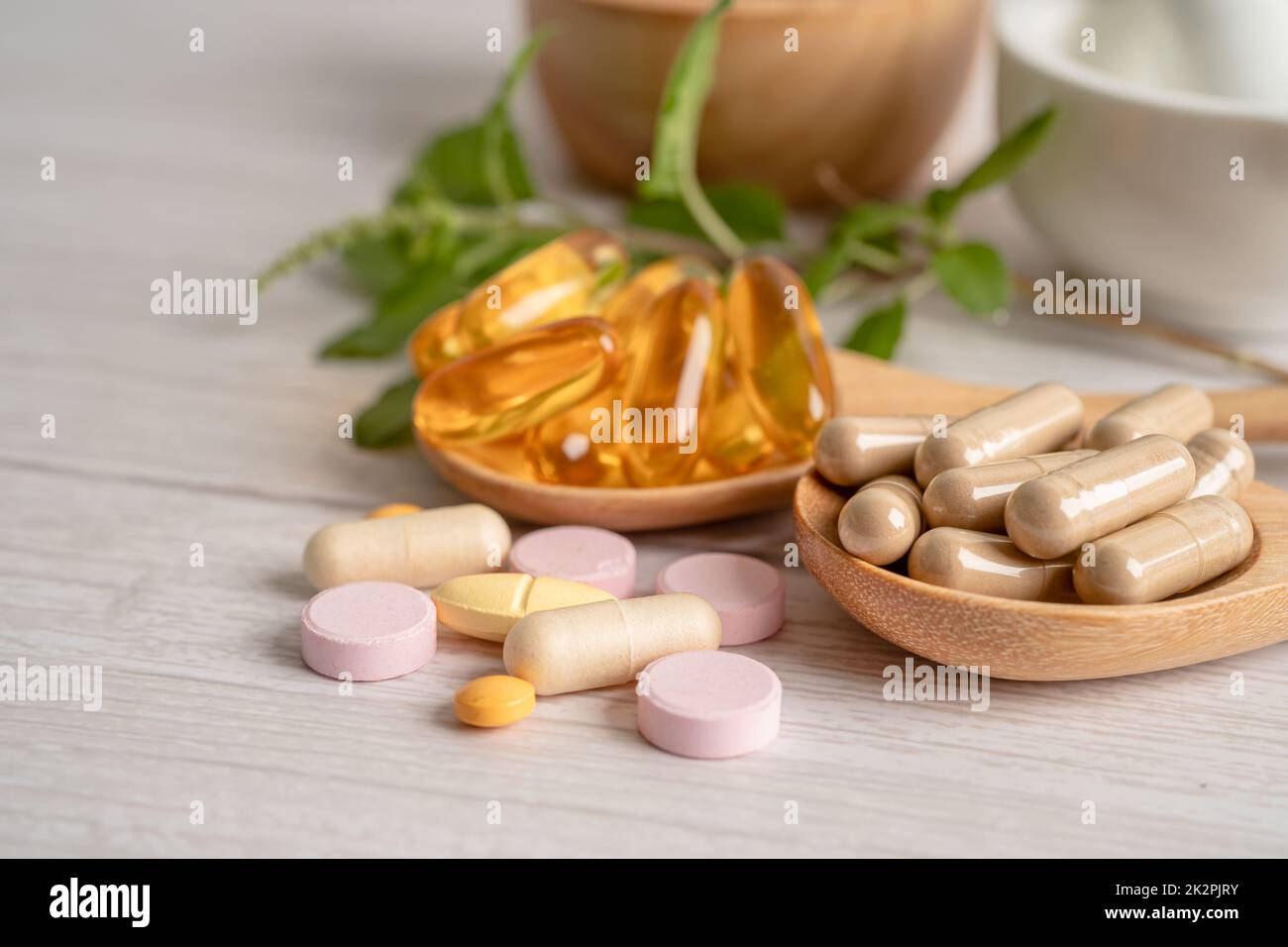 Alternative medicine herbal organic capsule drug with herbs leaf ...