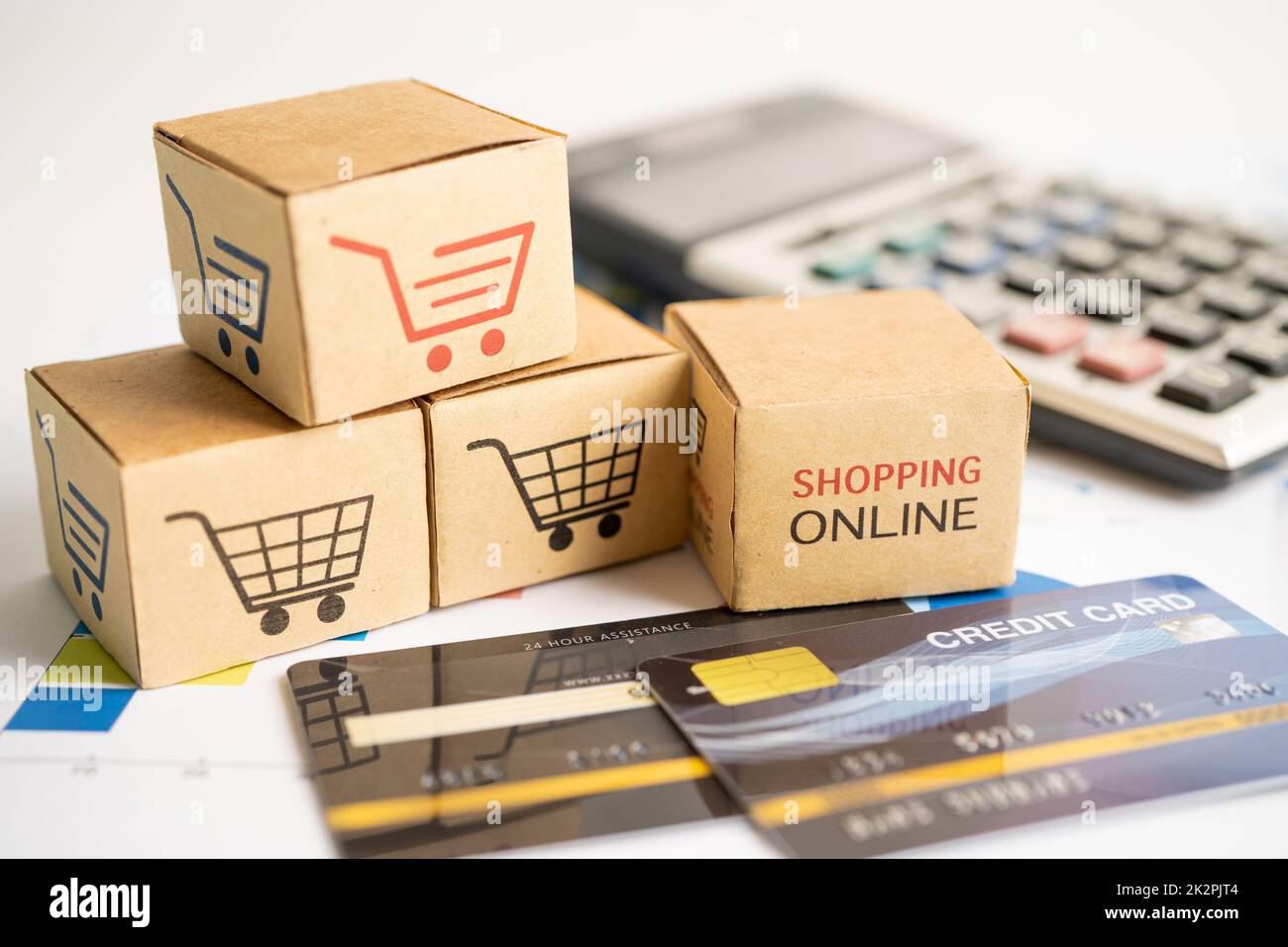 Shopping online box with credit card and calculator on graph. Finance ...