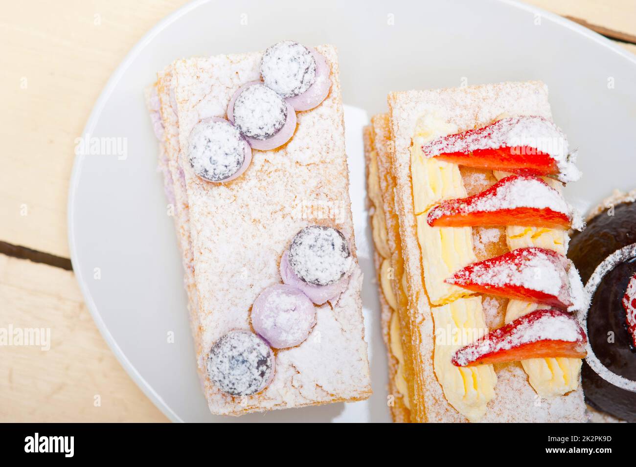 selection of fresh cream cake dessert plate Stock Photo - Alamy