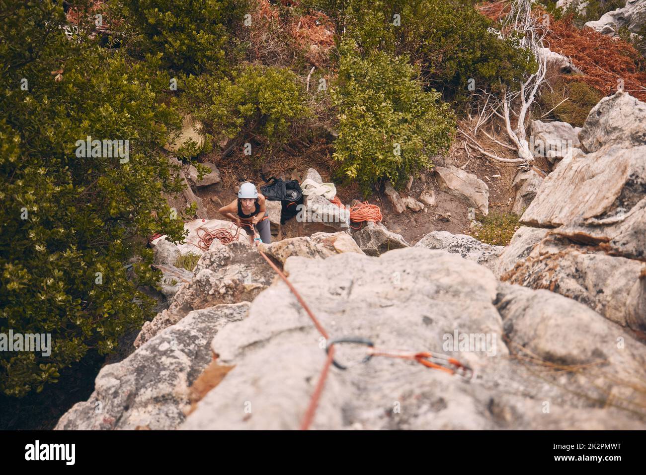 Climbing, abseiling and adventure with a woman climber hiking on a ...