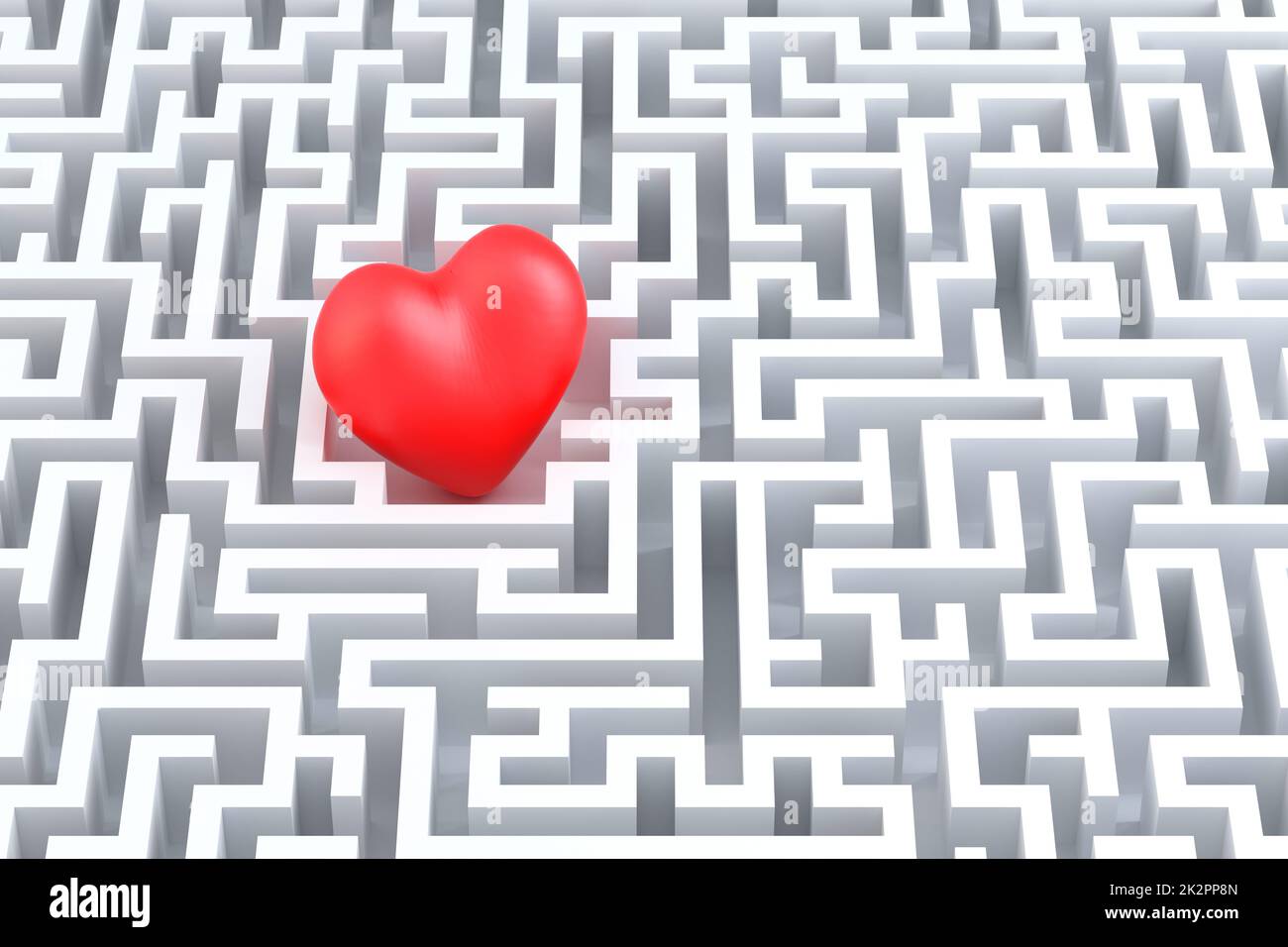 Red heart in the middle of the maze Stock Photo - Alamy